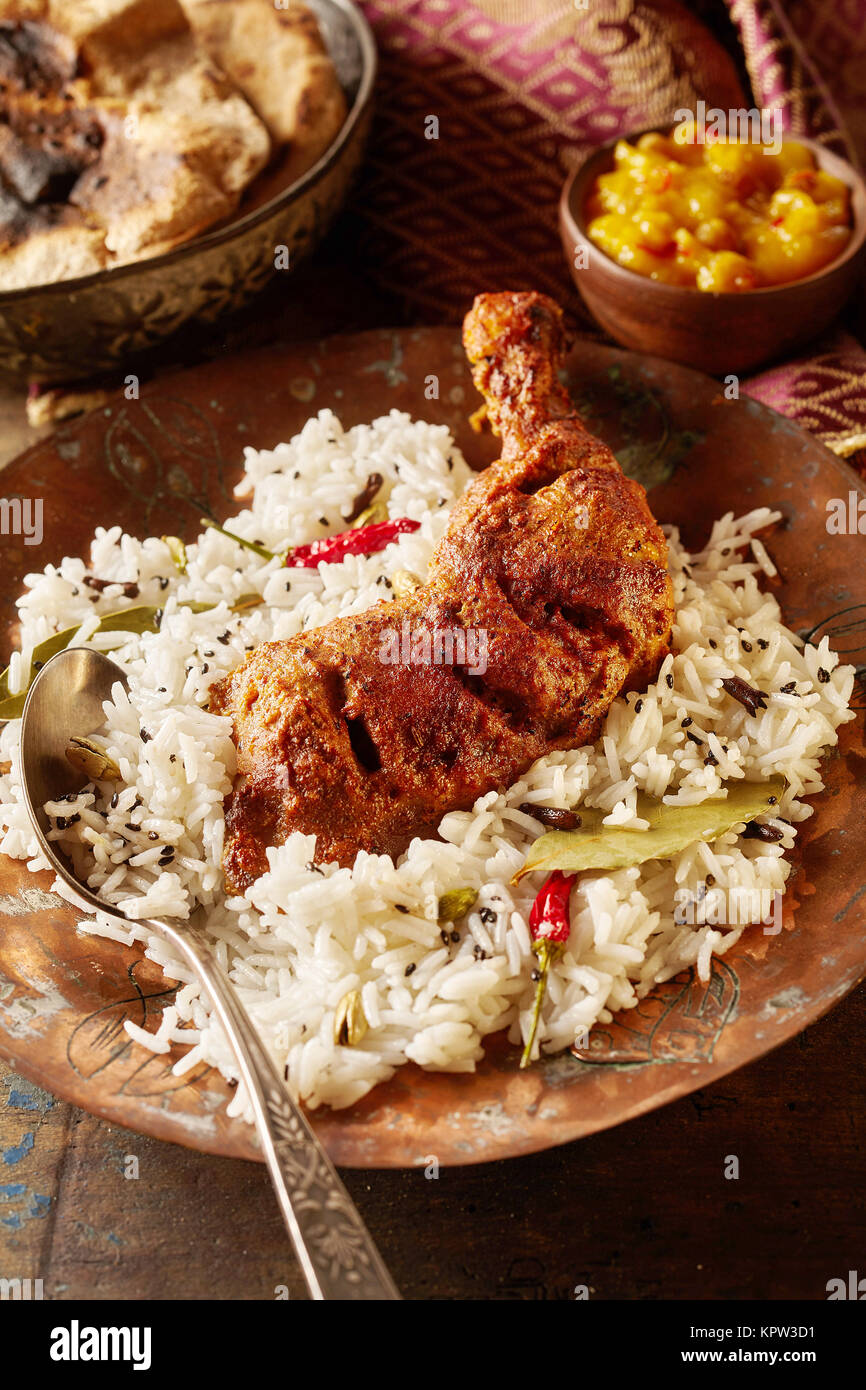 Close up of a hearty indian chicken drumsticks tandoori meal with spicy ...
