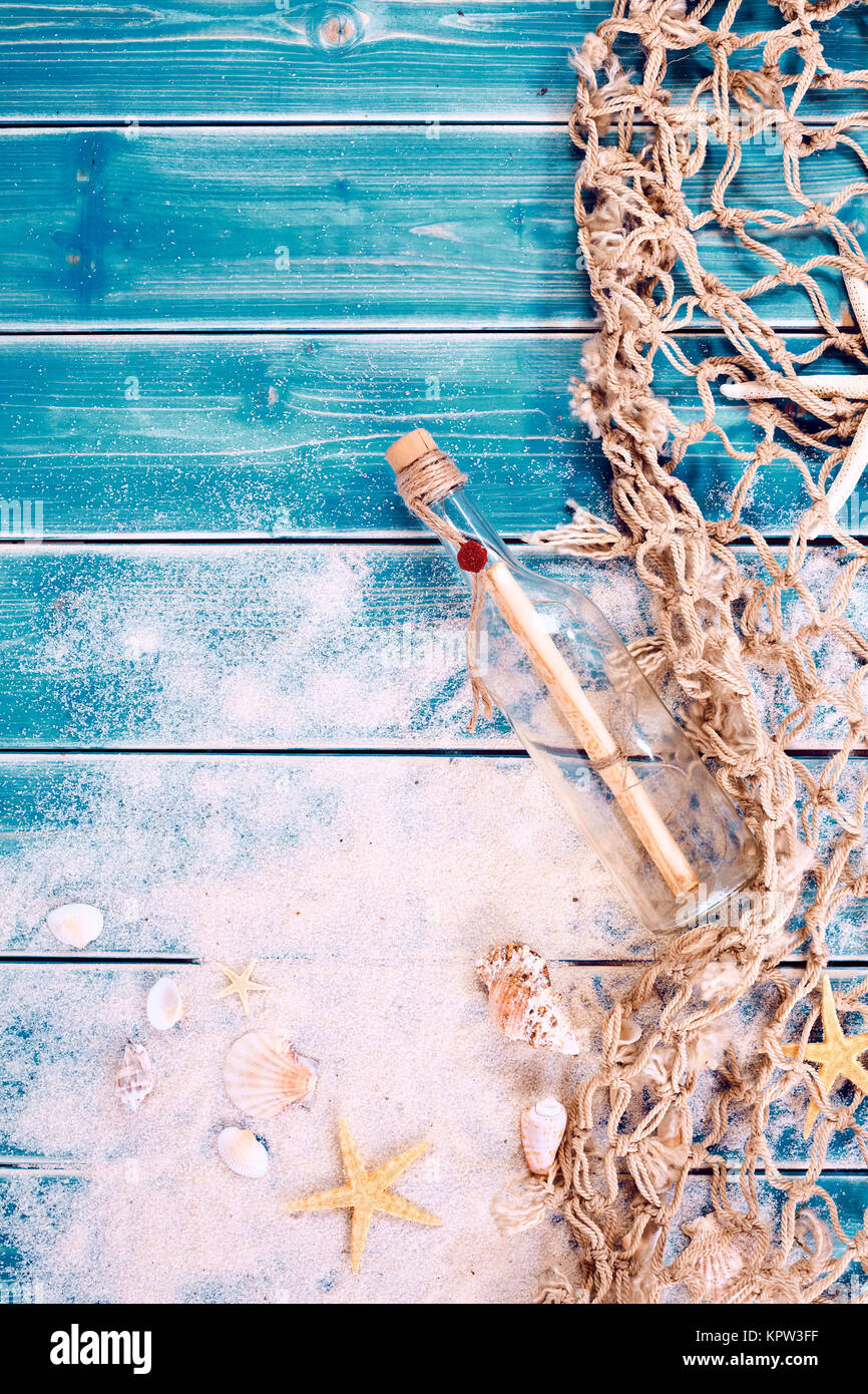 Nautical themed backdrop with message in a bottle, starfish and a ...