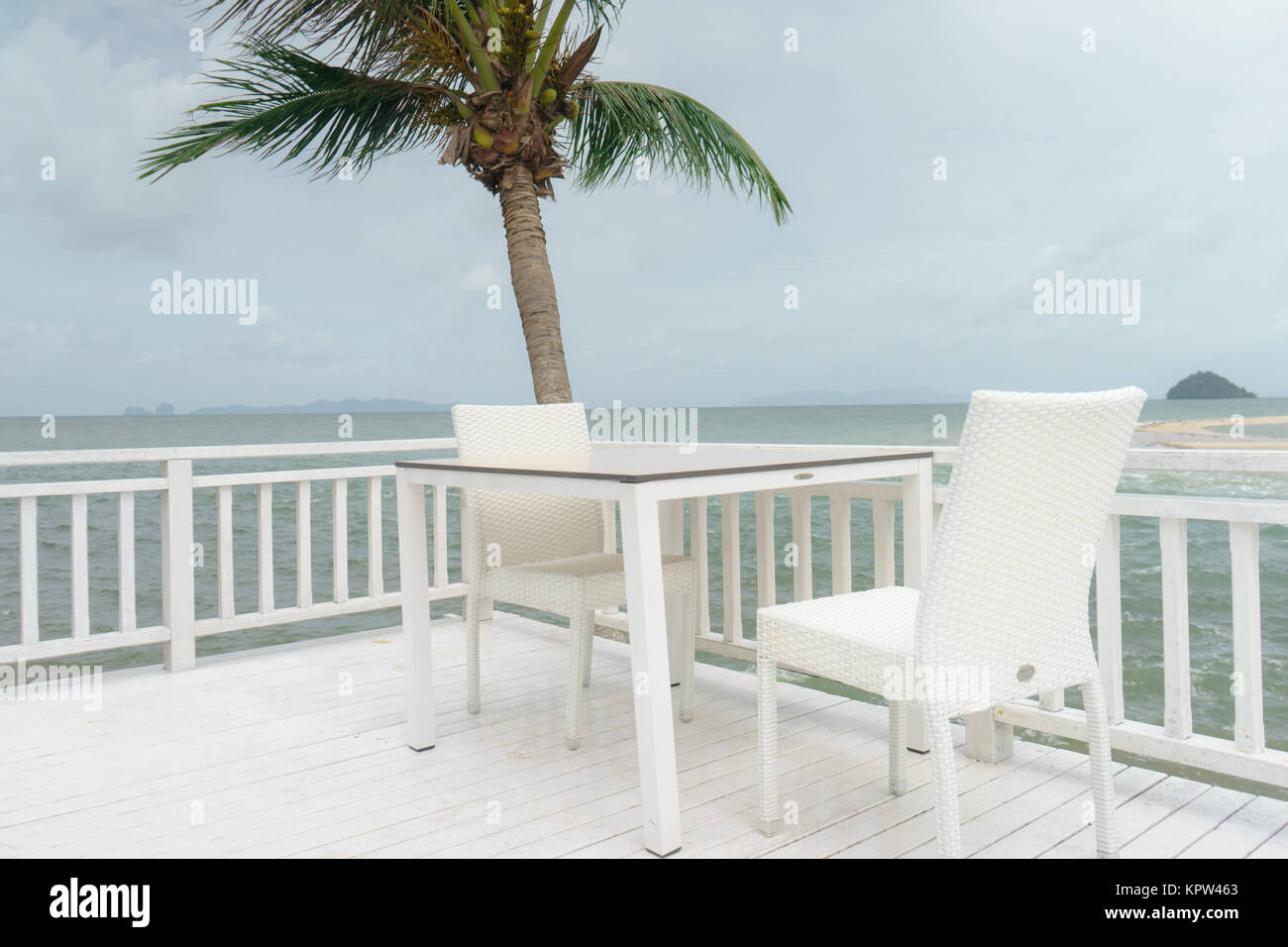 Table chair and coconut tree on sea landscape background Stock Photo ...