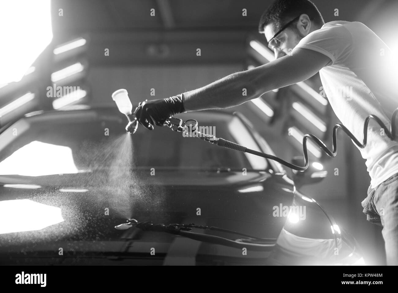 Car spraying paint Black and White Stock Photos & Images - Alamy