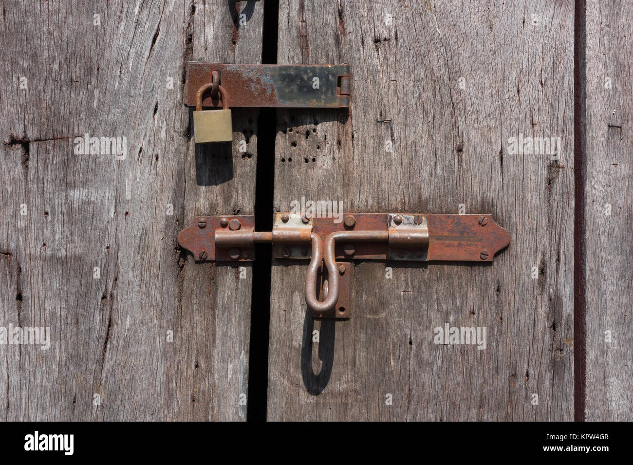 Closeup wooden door with lock Stock Photo - Alamy