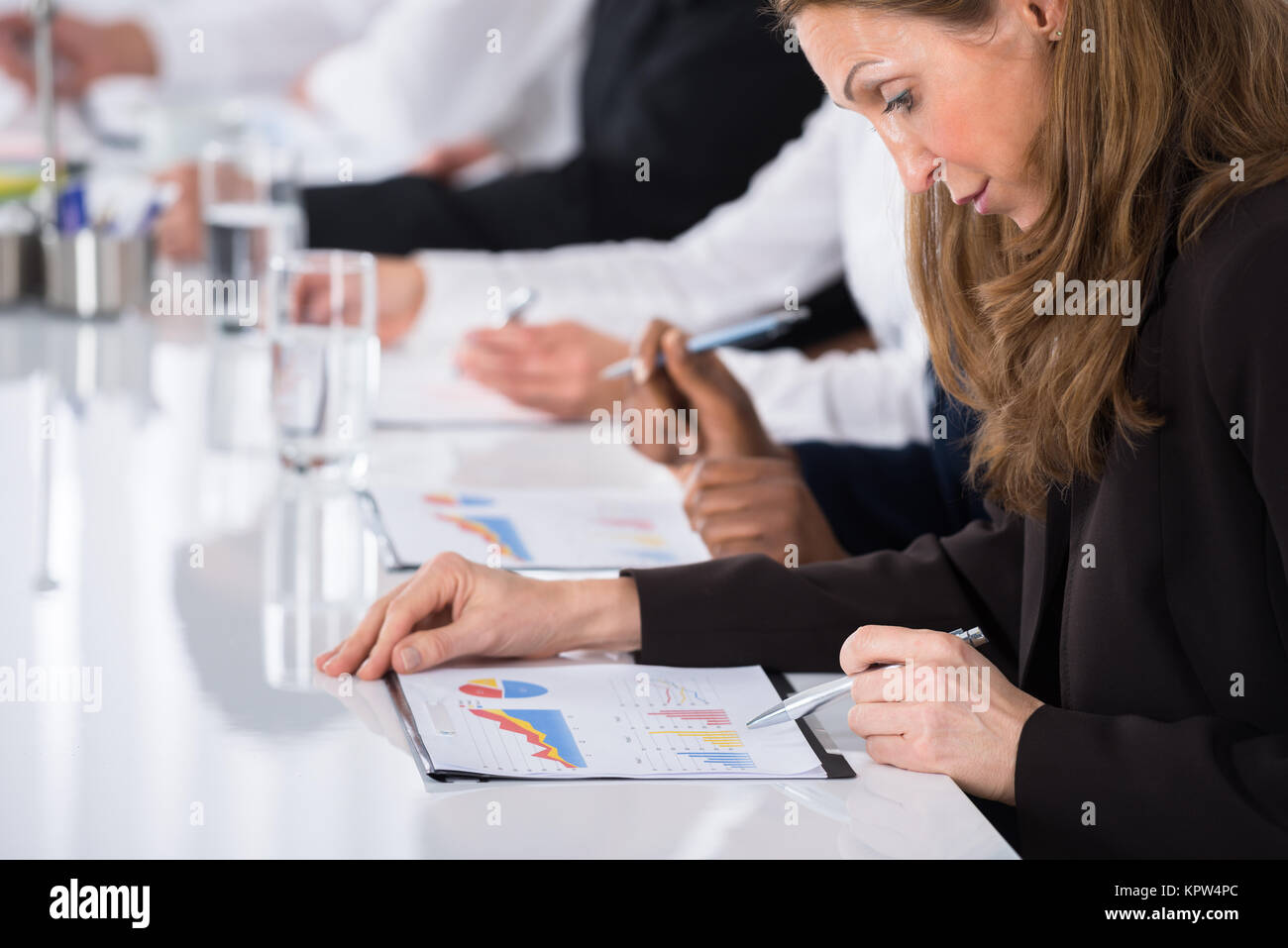Businesswoman Analyzing Graph Stock Photo - Alamy Businesswoman Analyzing Graph Stock Photo - Alamy