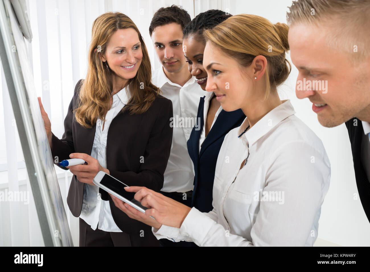 Manager Explaining Business Strategy To The Staffs Stock Photo - Alamy
