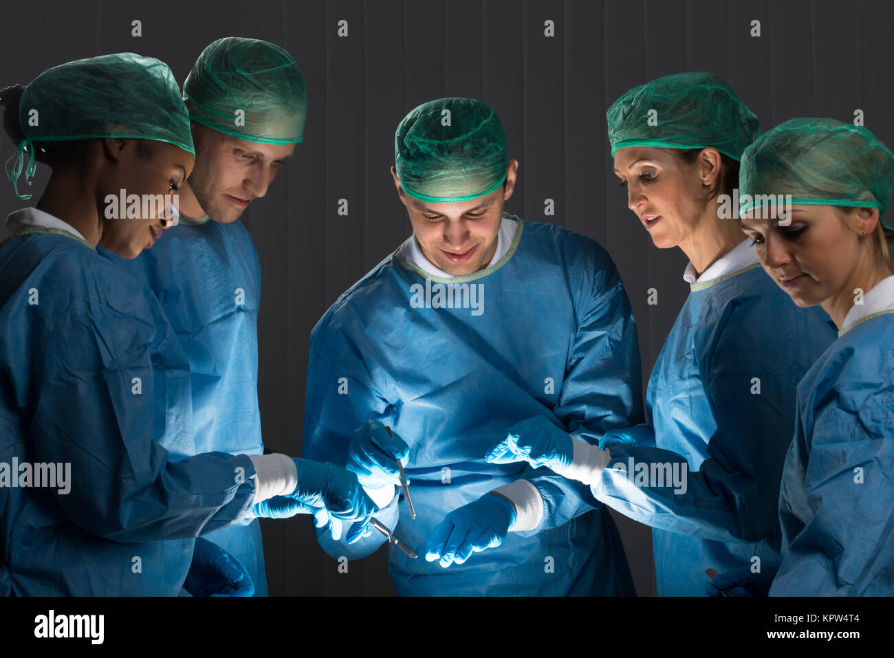 Surgeons In Operating Room Stock Photo - Alamy