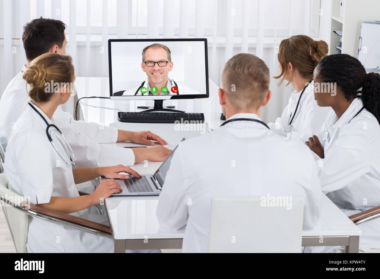 Doctors Videoconferencing On Computer In Hospital Stock Photo - Alamy