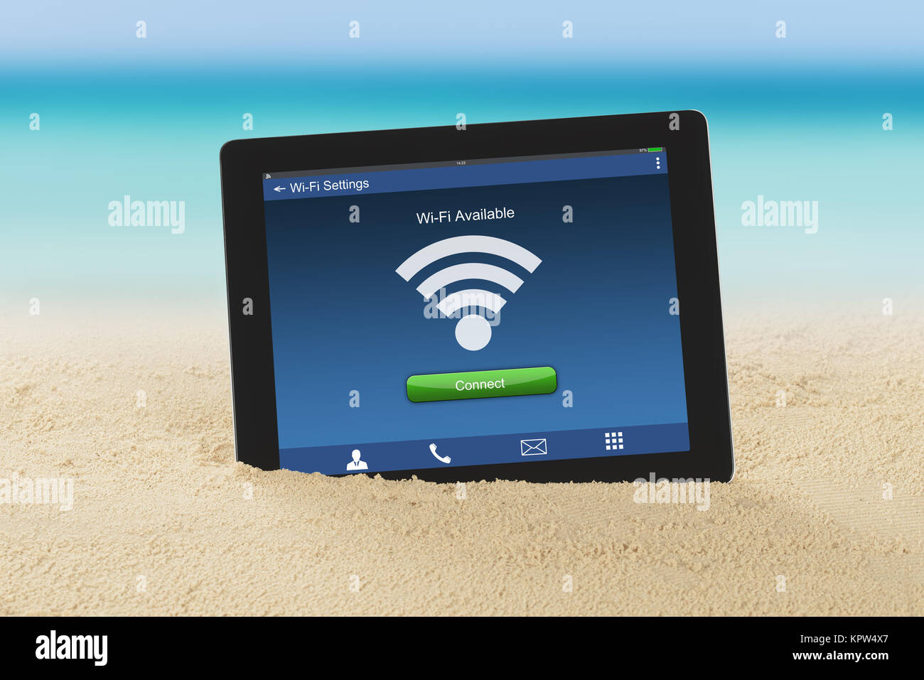Digital Tablet On Sand Stock Photo - Alamy