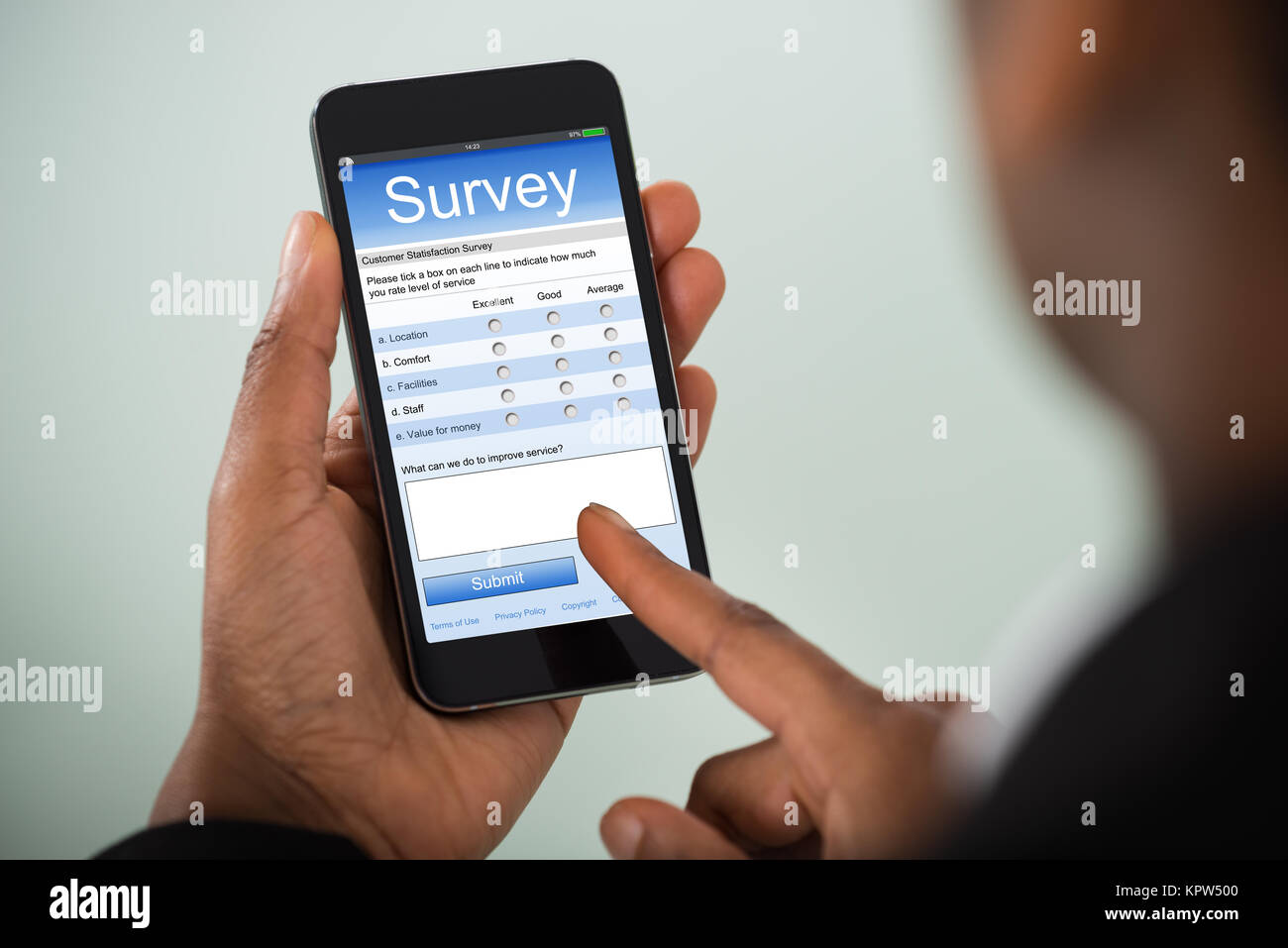 Businesswoman Filling Online Survey On Mobile Phone Stock Photo - Alamy