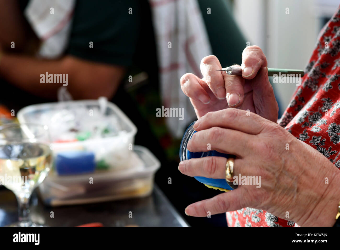 Elderly woman's hands using a scapel to craft with modelling clay Stock ...