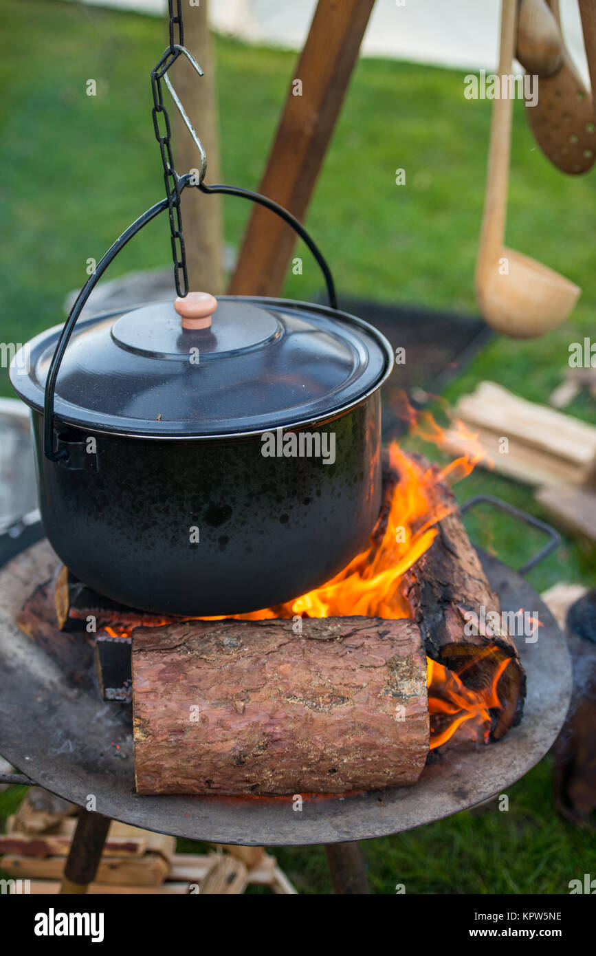 boiling over the fire Stock Photo - Alamy