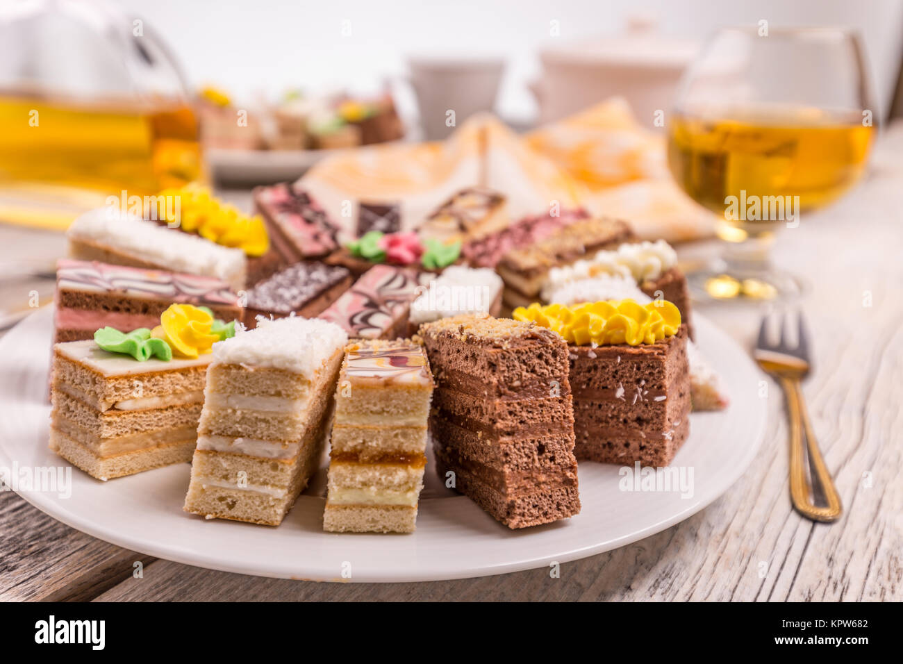 Small cakes with different cream Stock Photo - Alamy