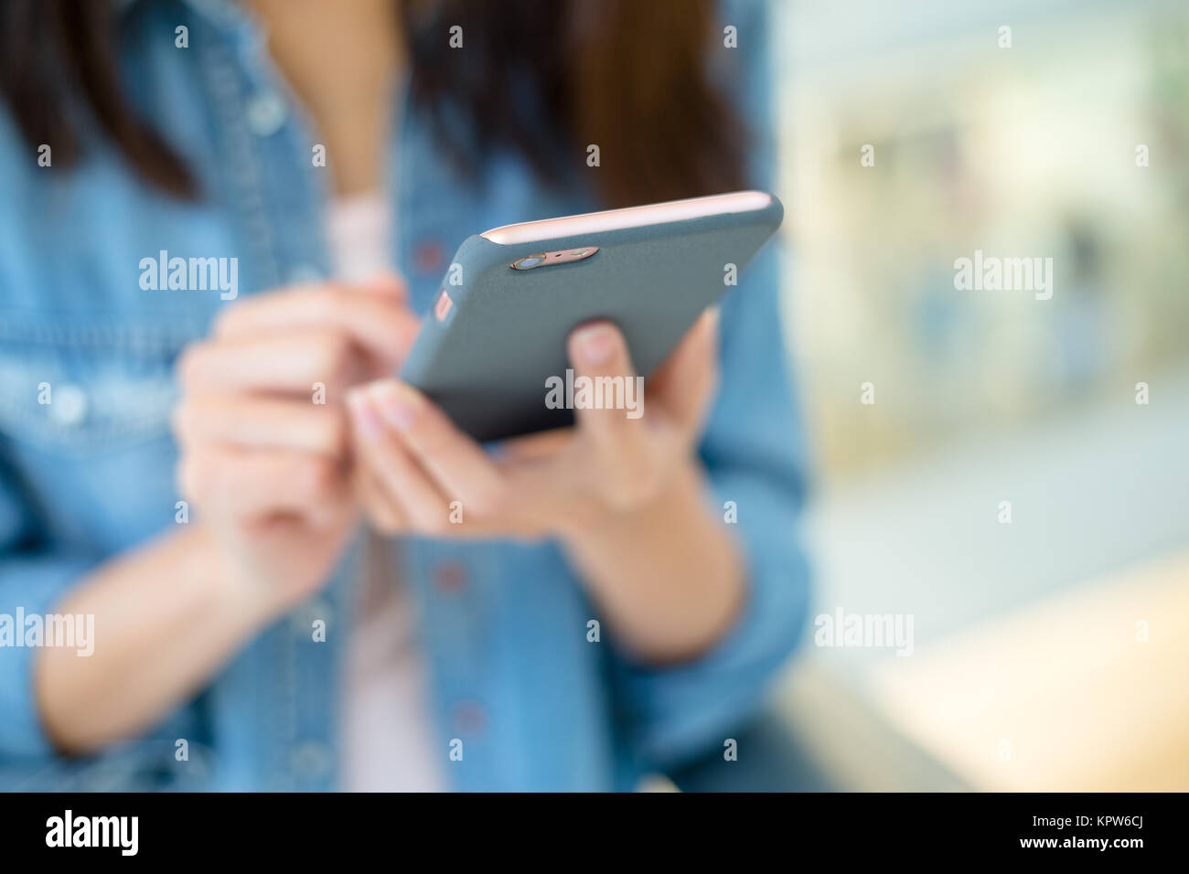 Woman sending message with smartphone Stock Photo - Alamy