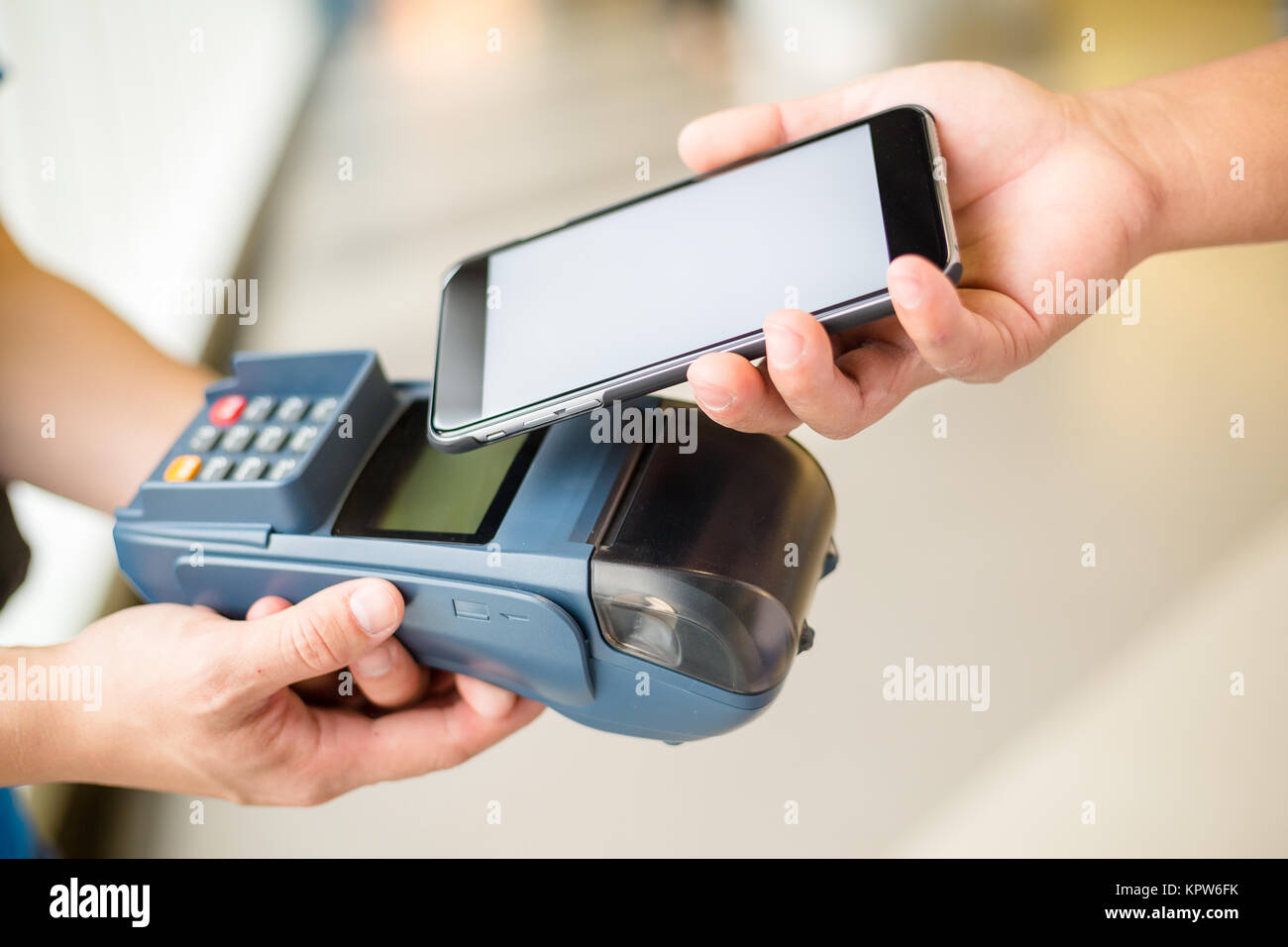 Customer pay the bill with smart phone Stock Photo - Alamy