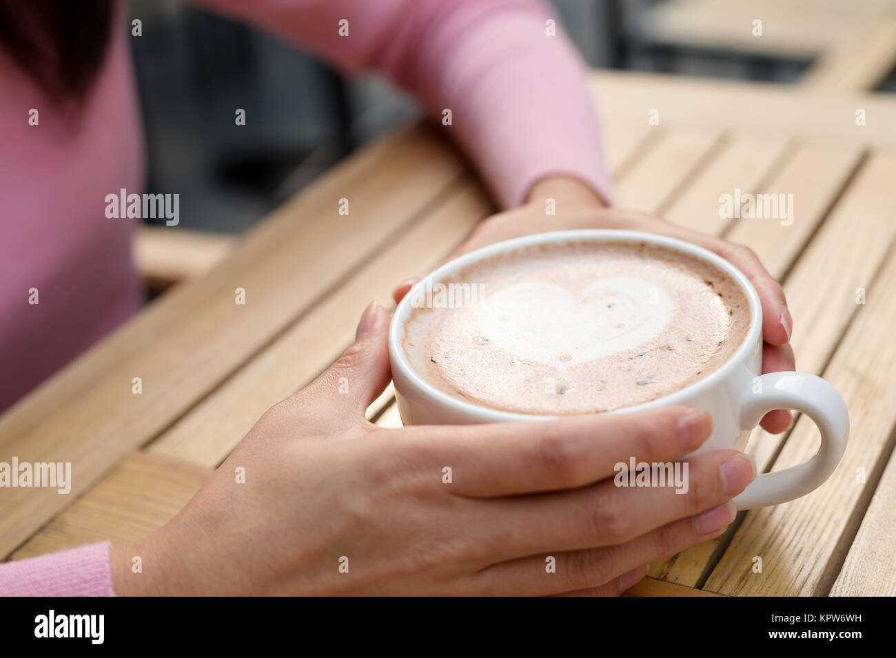 Woman having coffee Stock Photo - Alamy