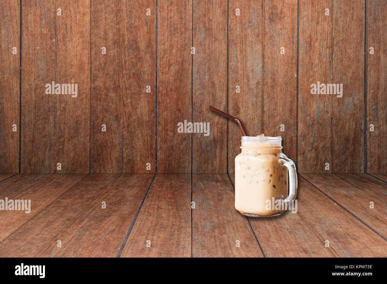 Iced coffee on old wooden interior texture background Stock Photo - Alamy