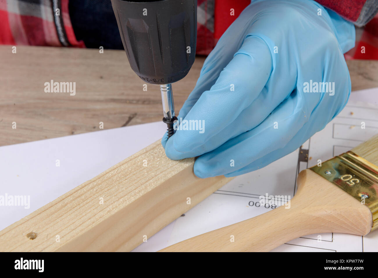 Carpenter drilling hole in plank Stock Photo - Alamy