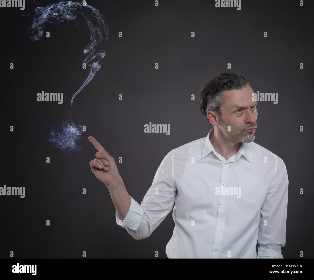 Businessman with question mark Stock Photo - Alamy