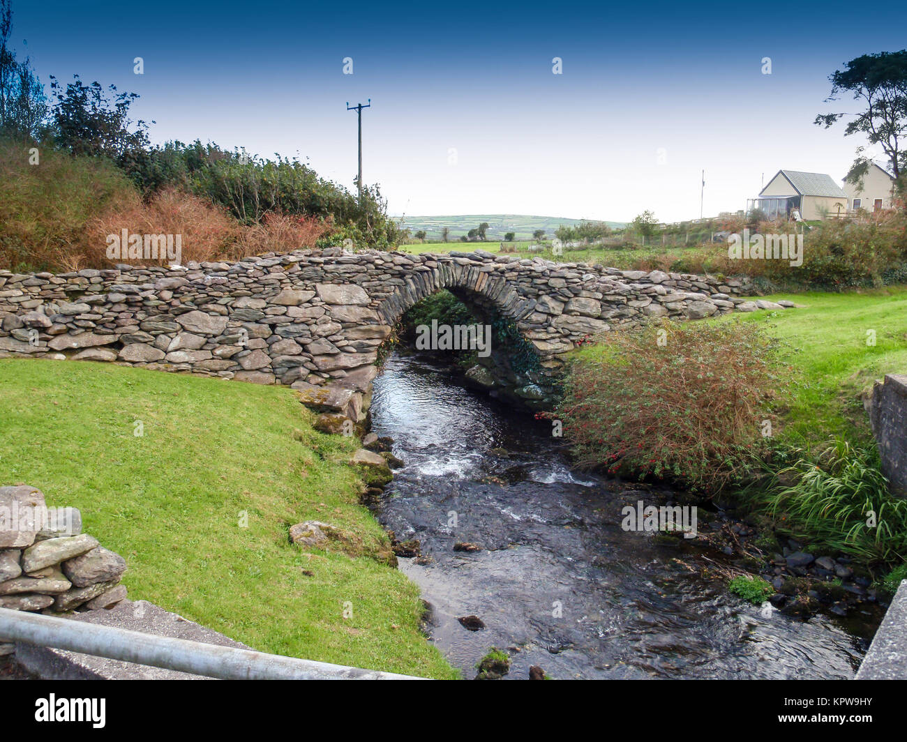 Old stone bridge with a rivulet on the Dingle peninsula in Ireland ...