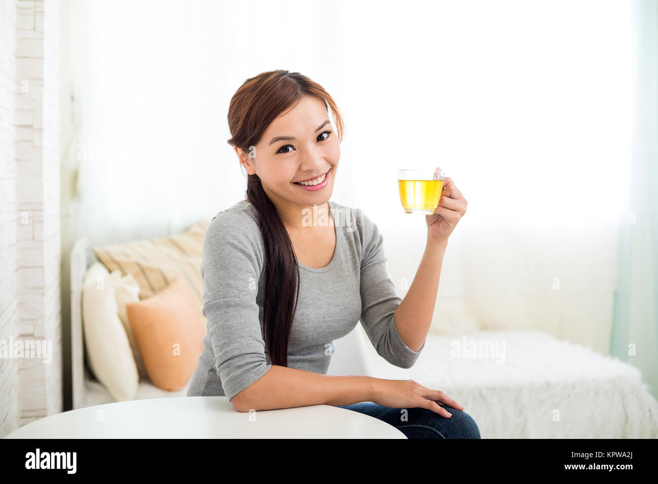 Woman enjoy her tea during break time Stock Photo - Alamy