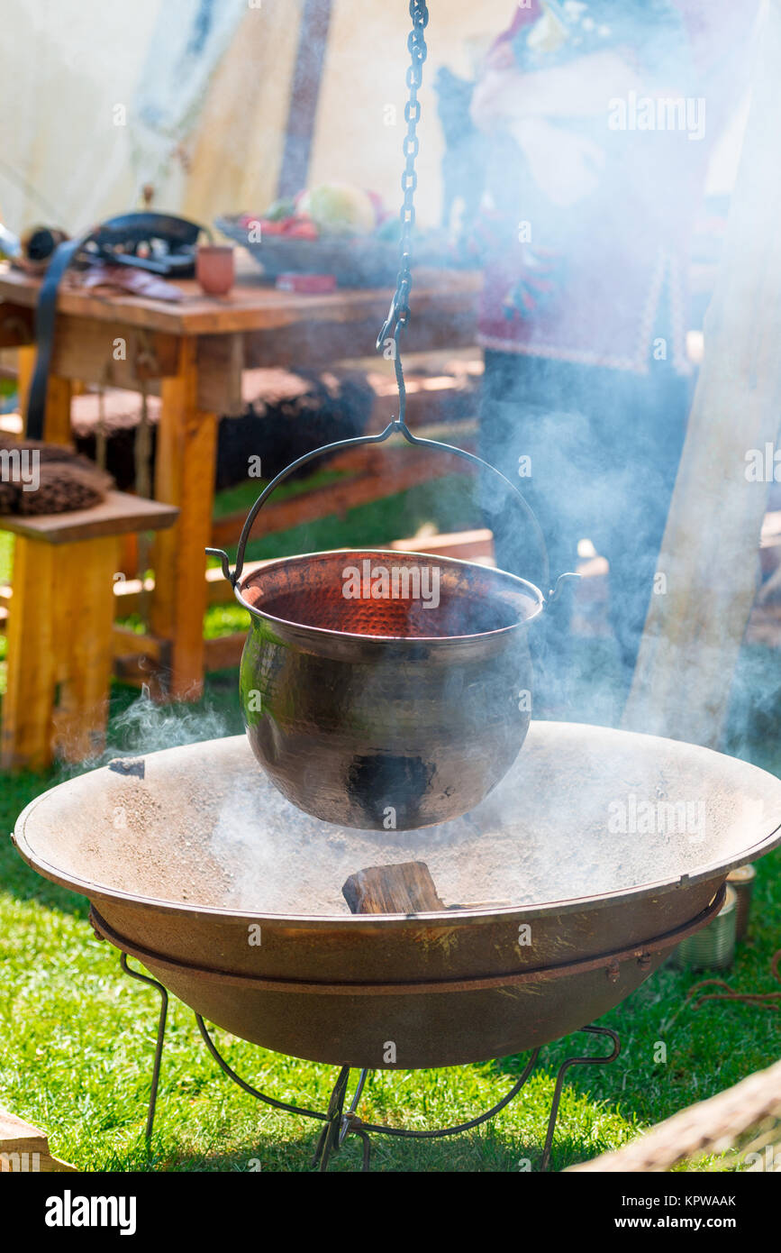 boiling over the fire Stock Photo - Alamy