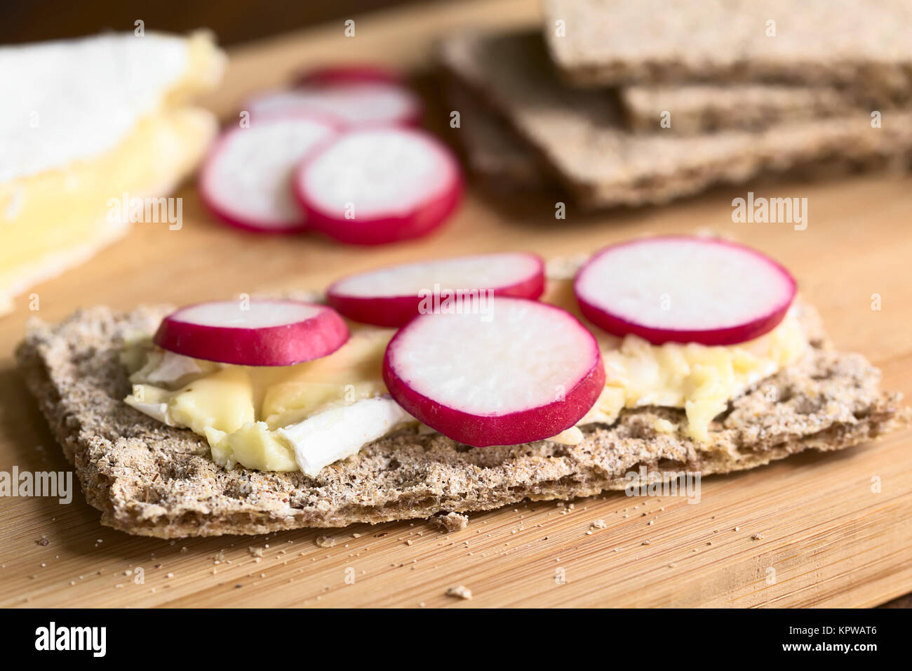 Wholemeal Rye Crispbread with Brie and Radish Stock Photo - Alamy