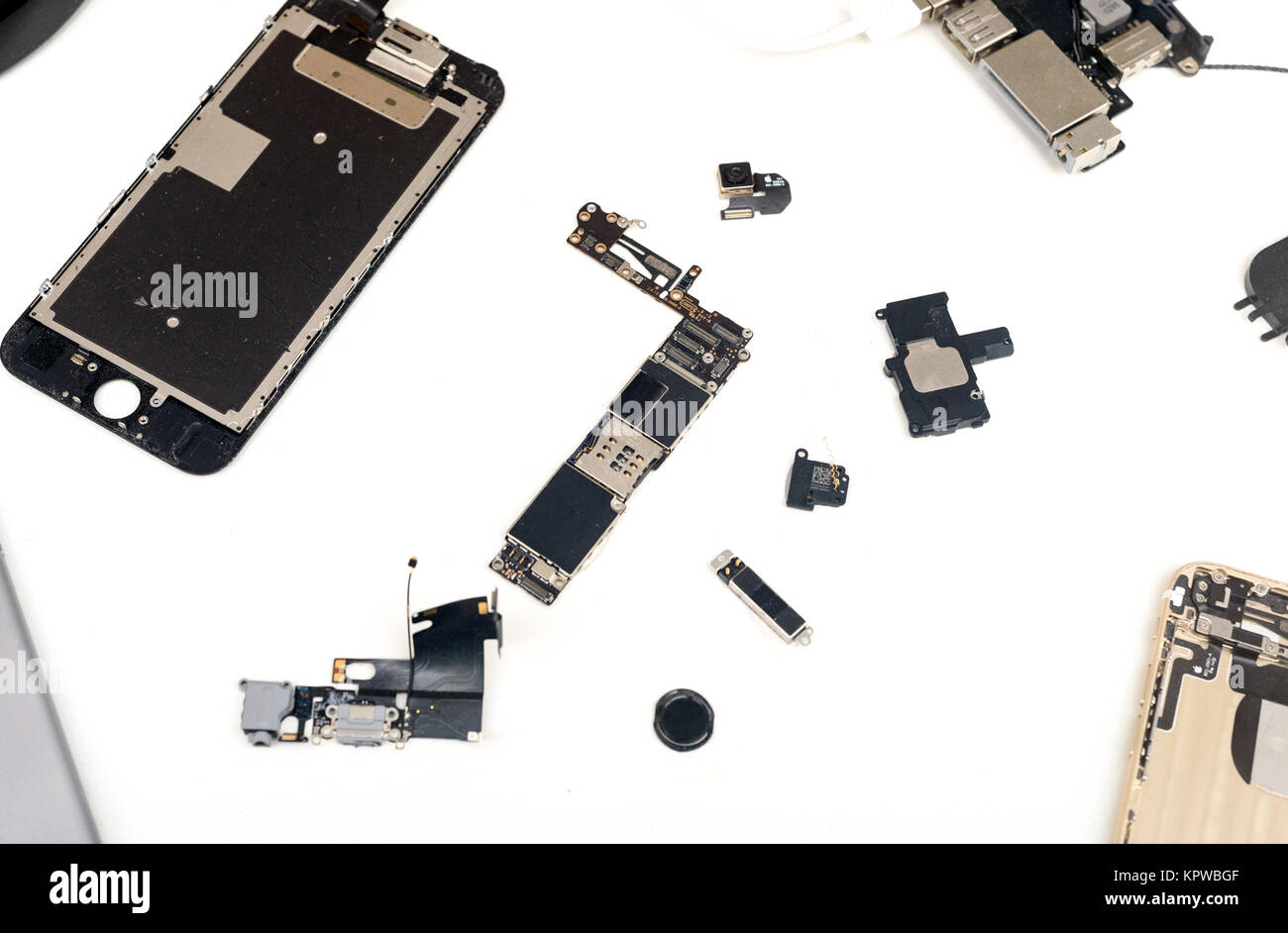 Broken components of an apple macbook ipad computer on a white ...