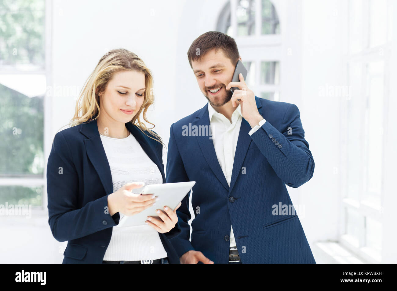 Male and female office workers Stock Photo - Alamy