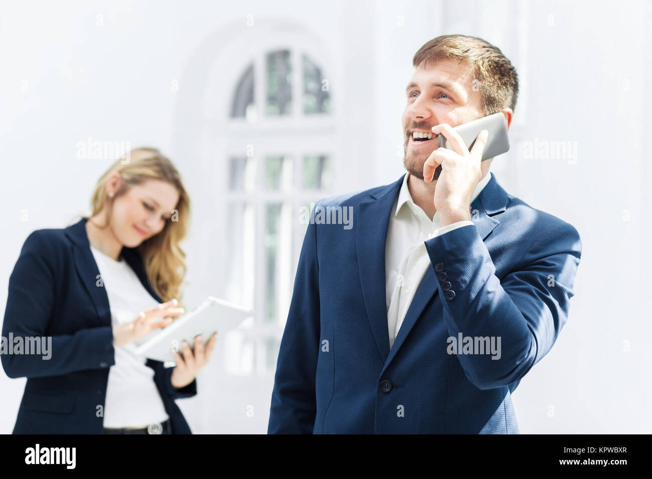 Male and female office workers Stock Photo - Alamy