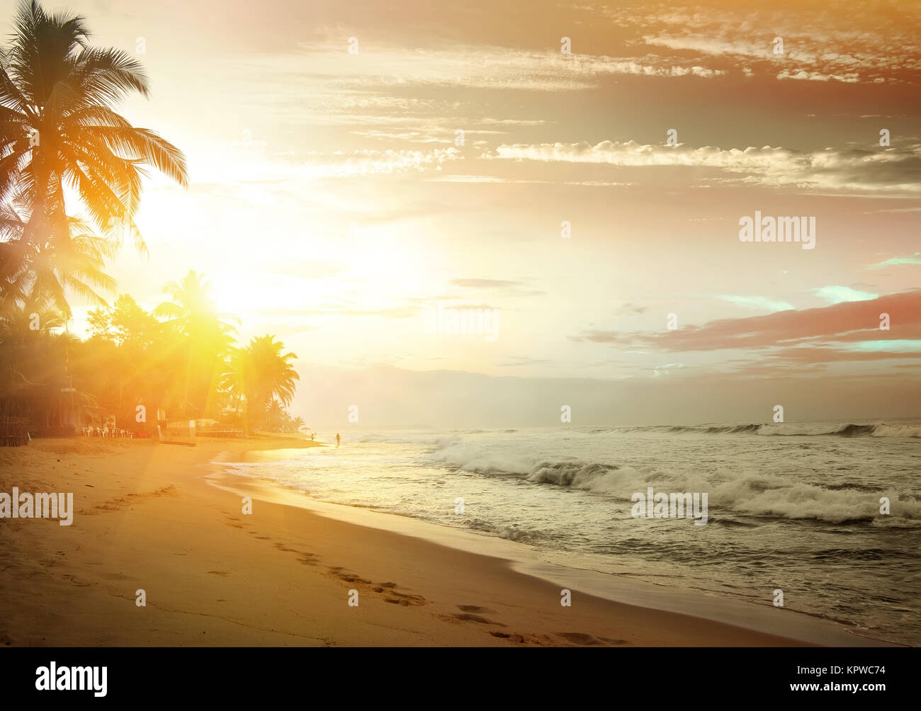 Pink sunset over ocean Stock Photo - Alamy