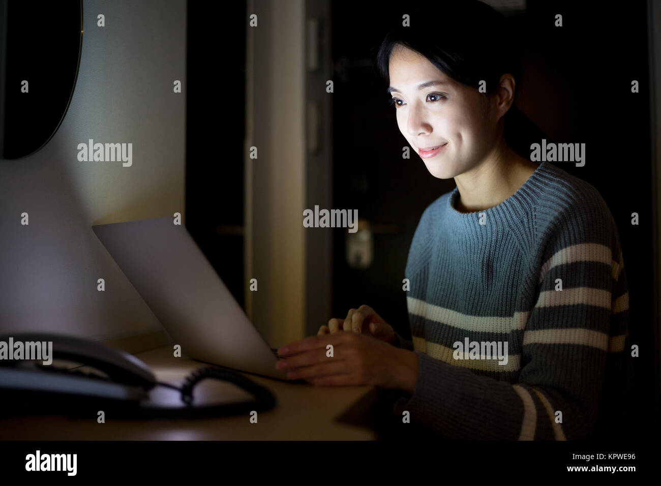 Young woman using a computer Stock Photo - Alamy