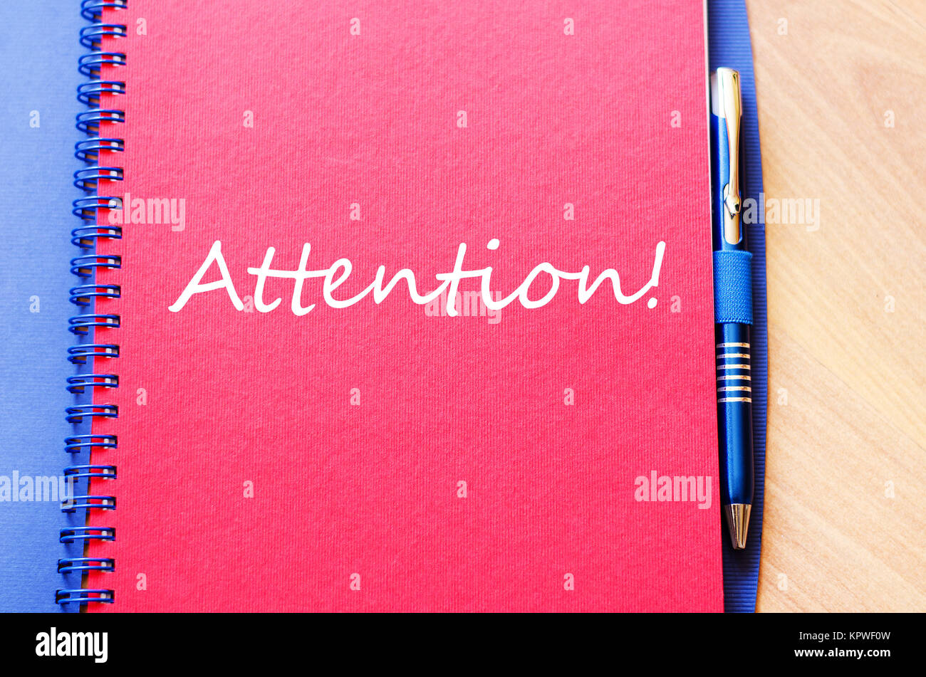 Attention write on notebook Stock Photo - Alamy