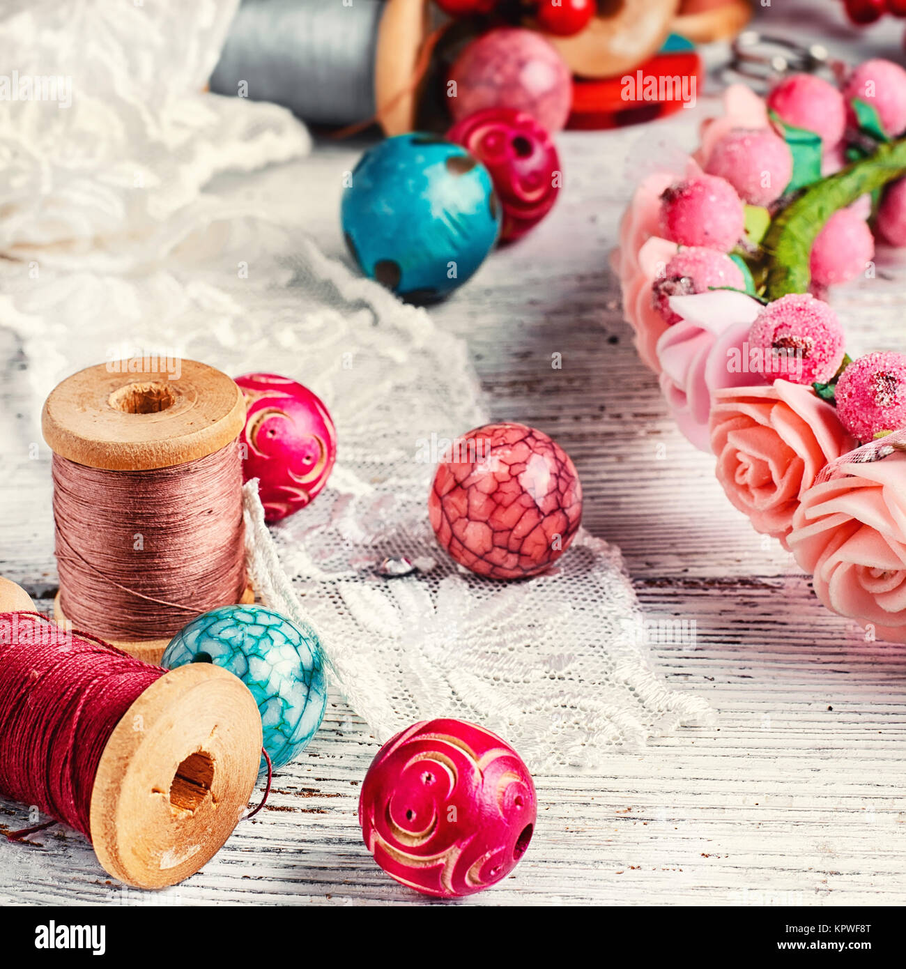 White lace,sewing thread and charming wooden bead Stock Photo - Alamy