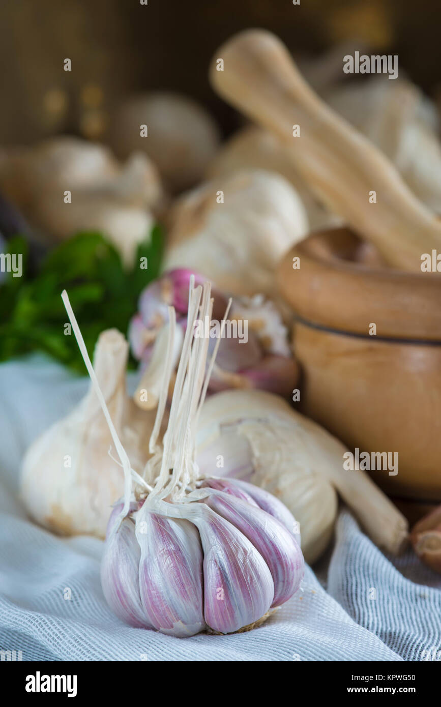 Garlic for cooking on the table of the kitchen Stock Photo - Alamy