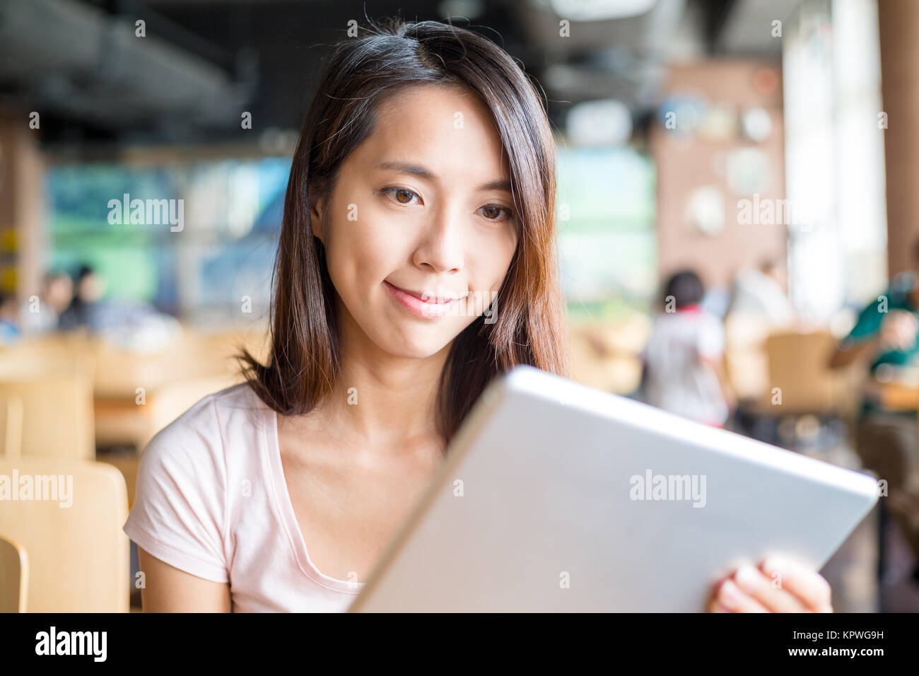 Woman use of tablet Stock Photo - Alamy