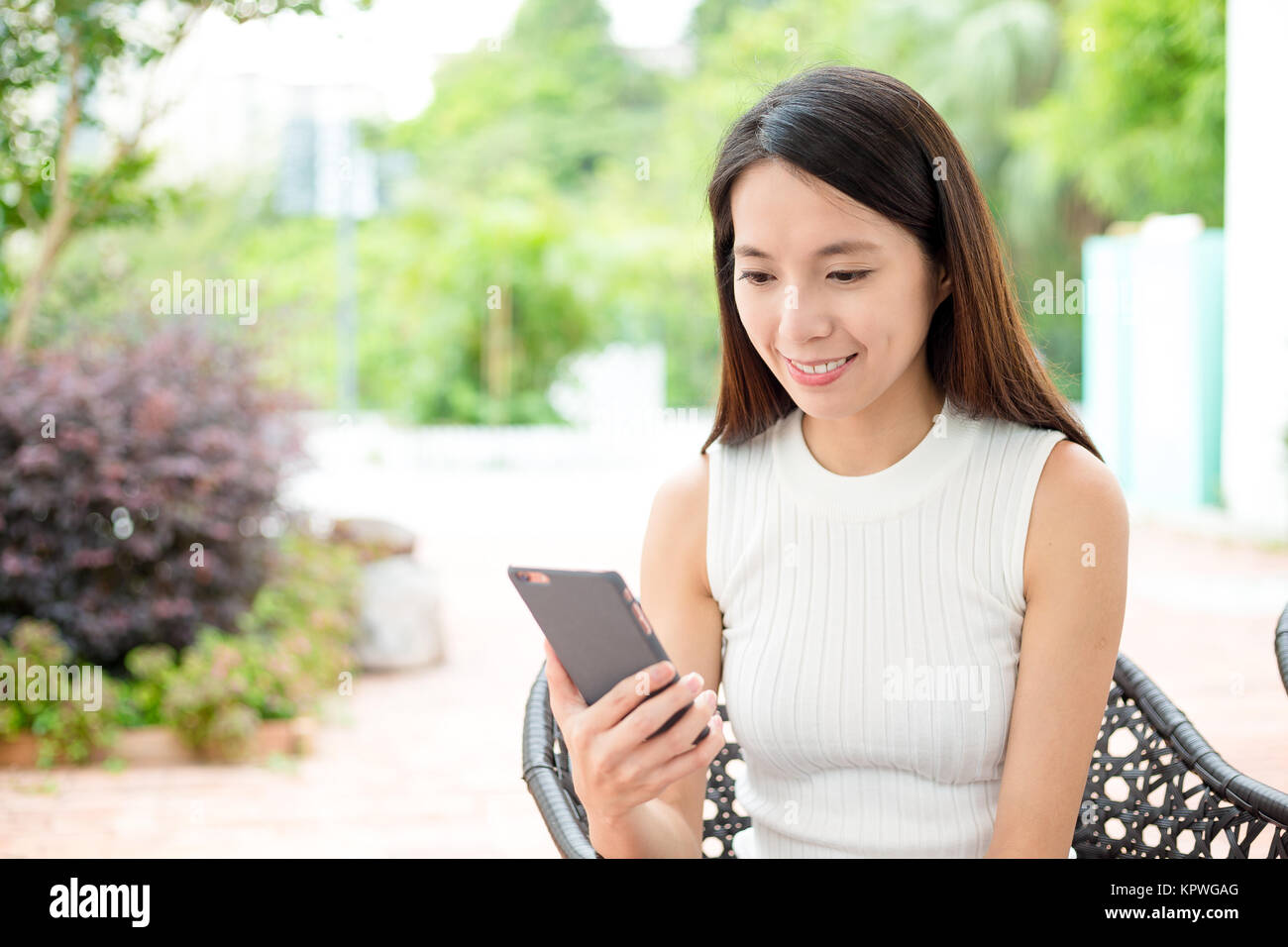 Woman using phone Stock Photo - Alamy