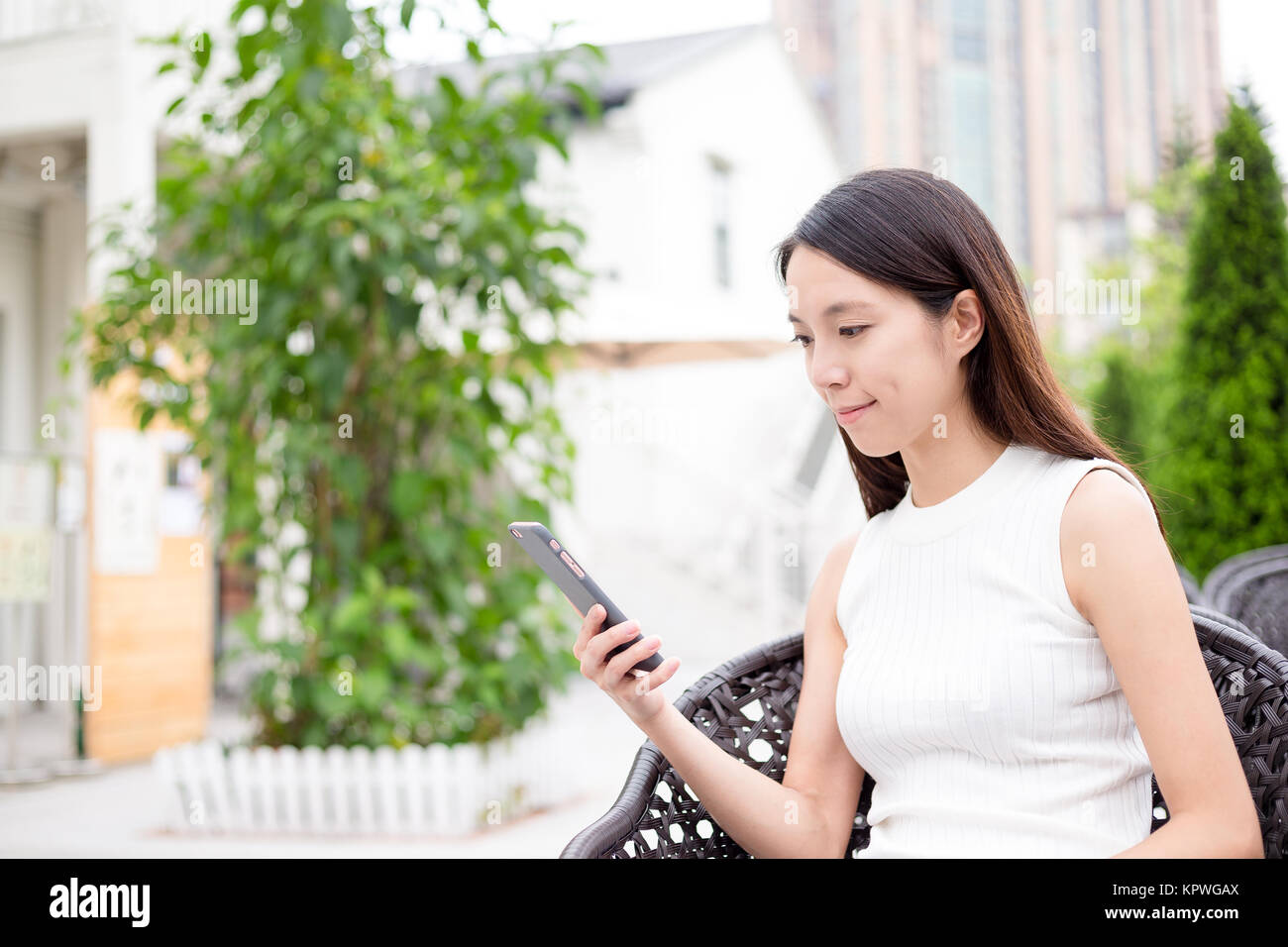 Young Woman browsing internet on phone Stock Photo - Alamy