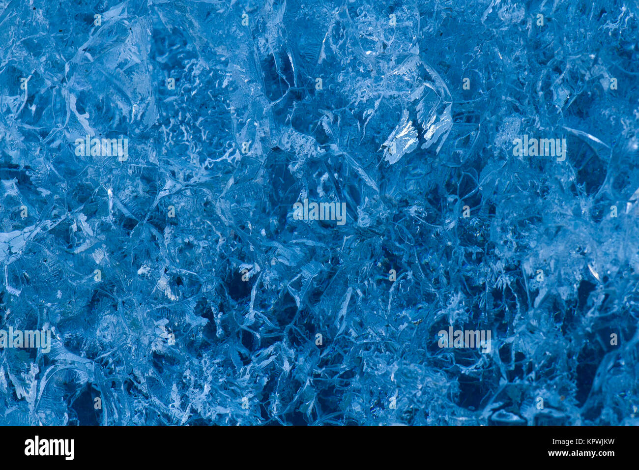 Up close view of blue glacier ice patterns Stock Photo - Alamy