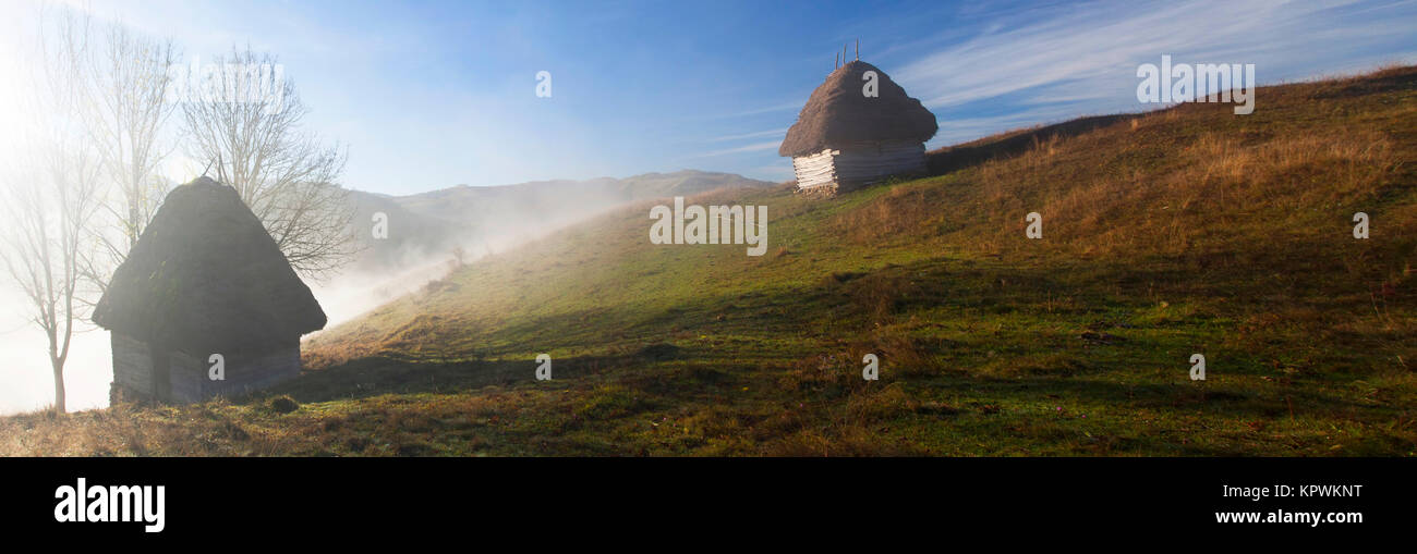 Small cottage in the mountains-panoramic view Stock Photo - Alamy
