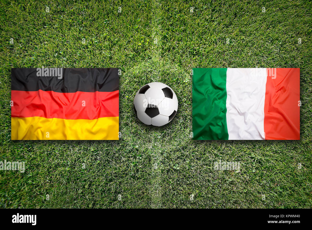Germany vs. Italy flags on soccer field Stock Photo - Alamy