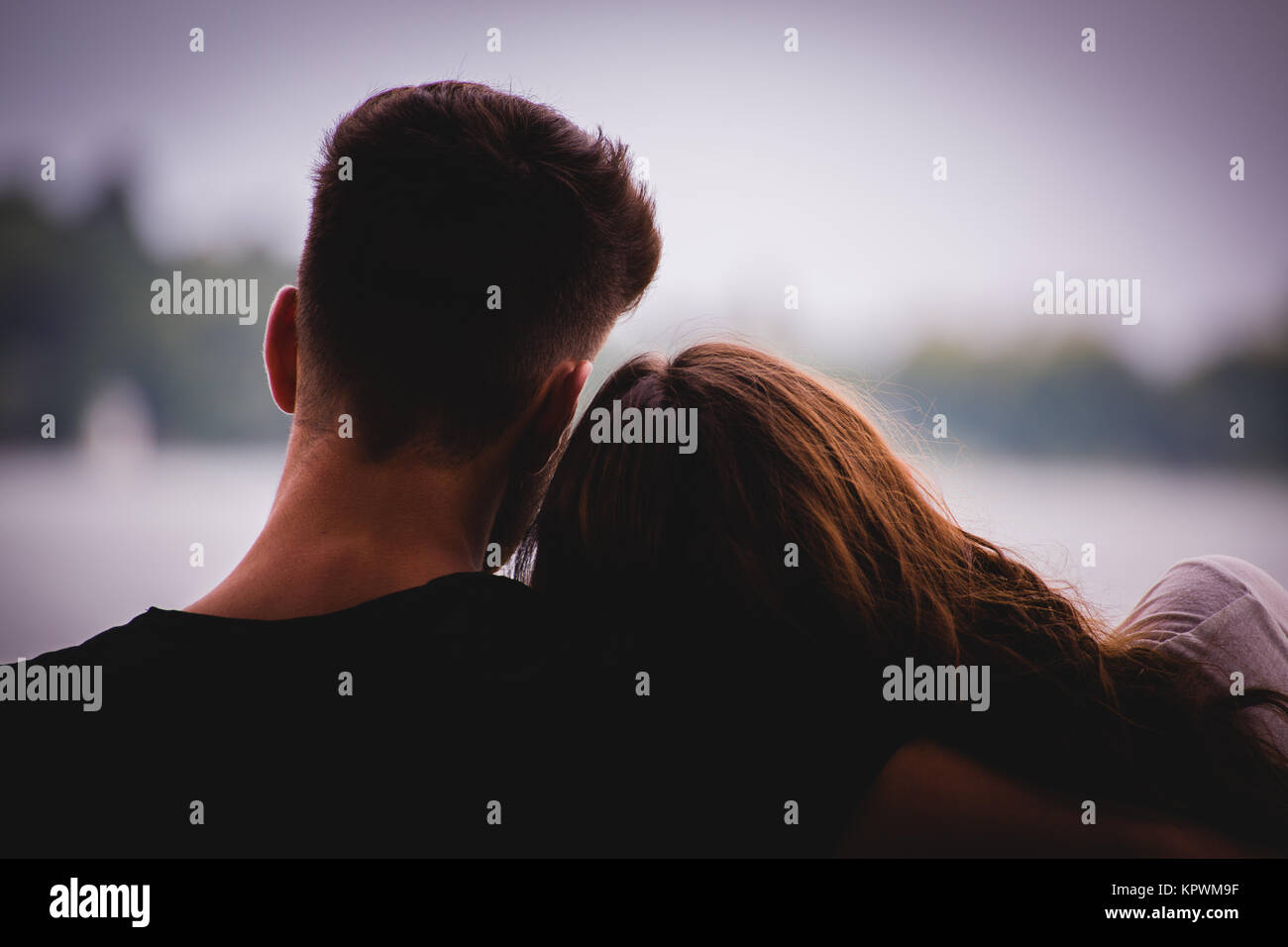 Back view of a young couple in love Stock Photo - Alamy