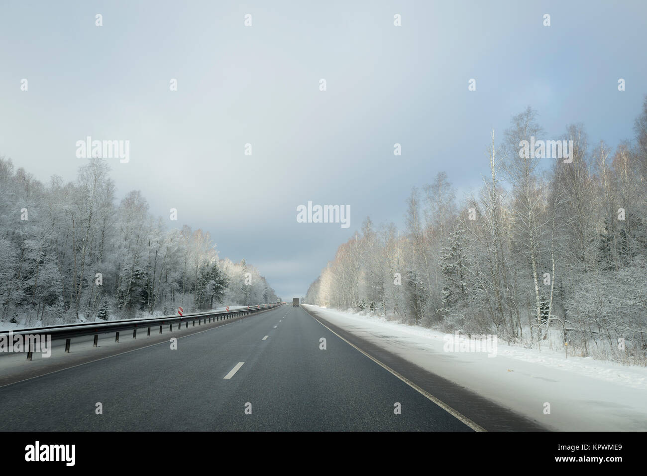 Winter road with frozen trees Stock Photo - Alamy
