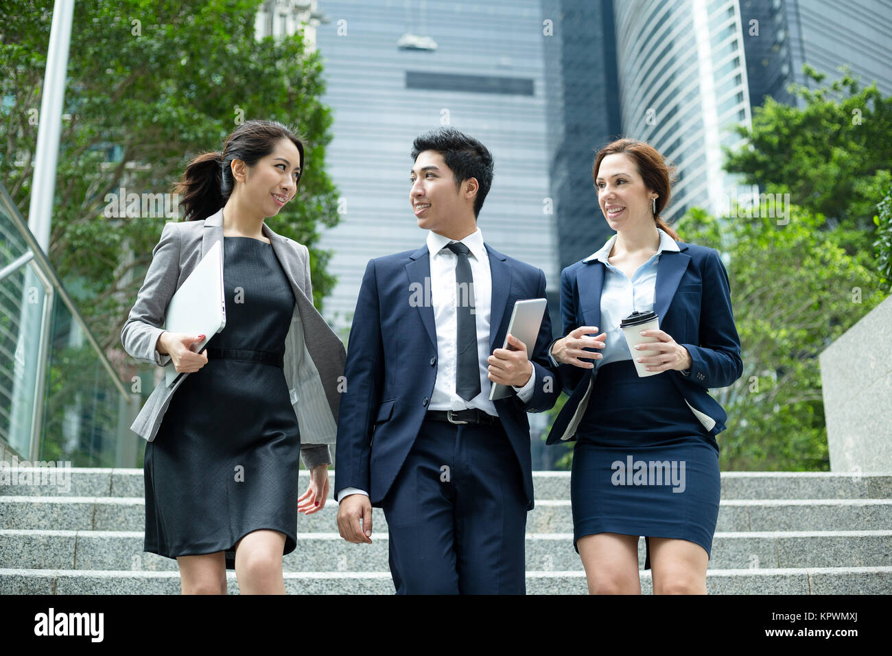 Business people walking outside office Stock Photo - Alamy