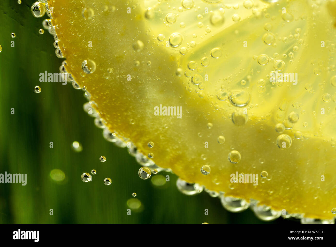 lemon in water background with water drops Stock Photo - Alamy