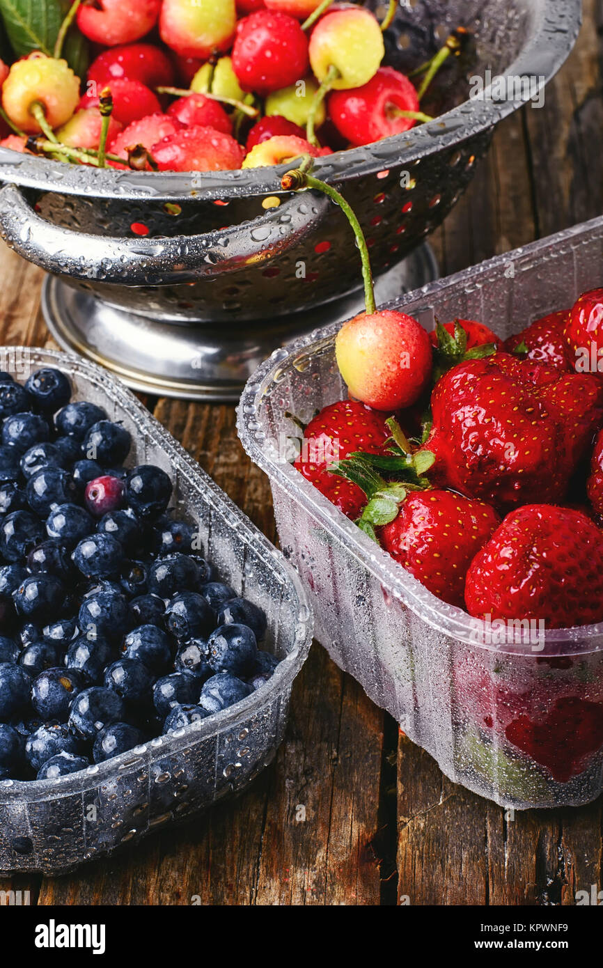 Harvest of ripe summer blueberries and cherries Stock Photo - Alamy