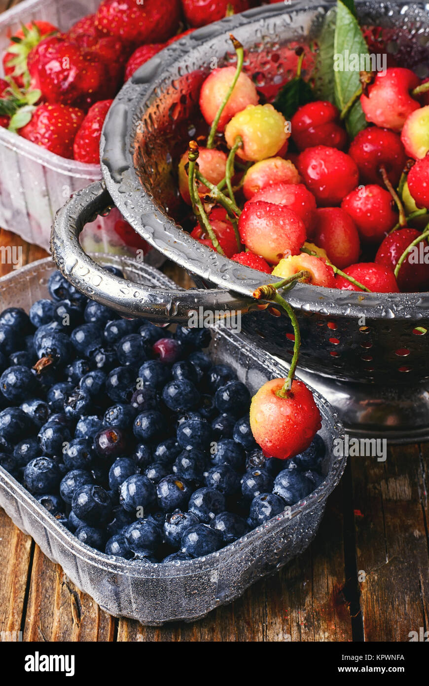 Harvest of ripe summer blueberries and cherries Stock Photo - Alamy