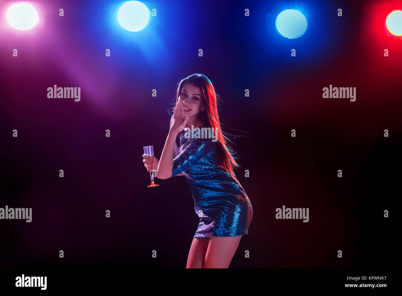 The beautiful girl dancing at the party drinking champagne Stock Photo ...