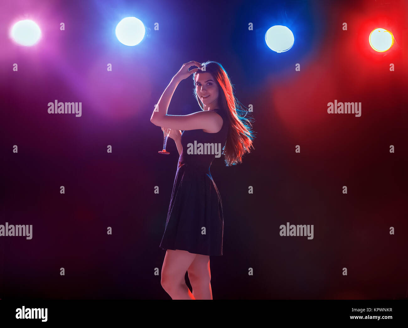 The beautiful girl dancing at the party drinking champagne Stock Photo ...