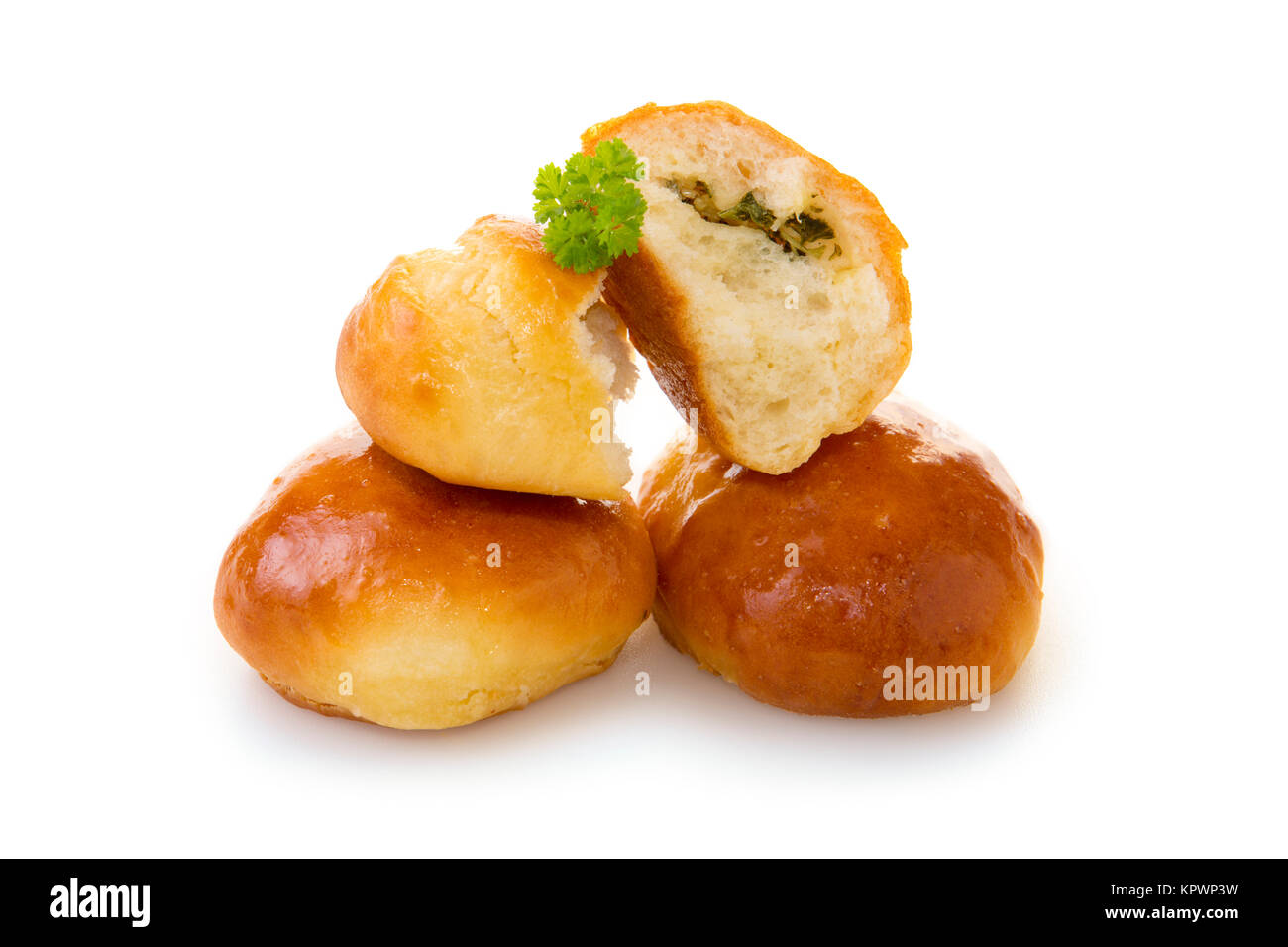 Bun with pickled vegetable filling isolated, cut in half on a white ...