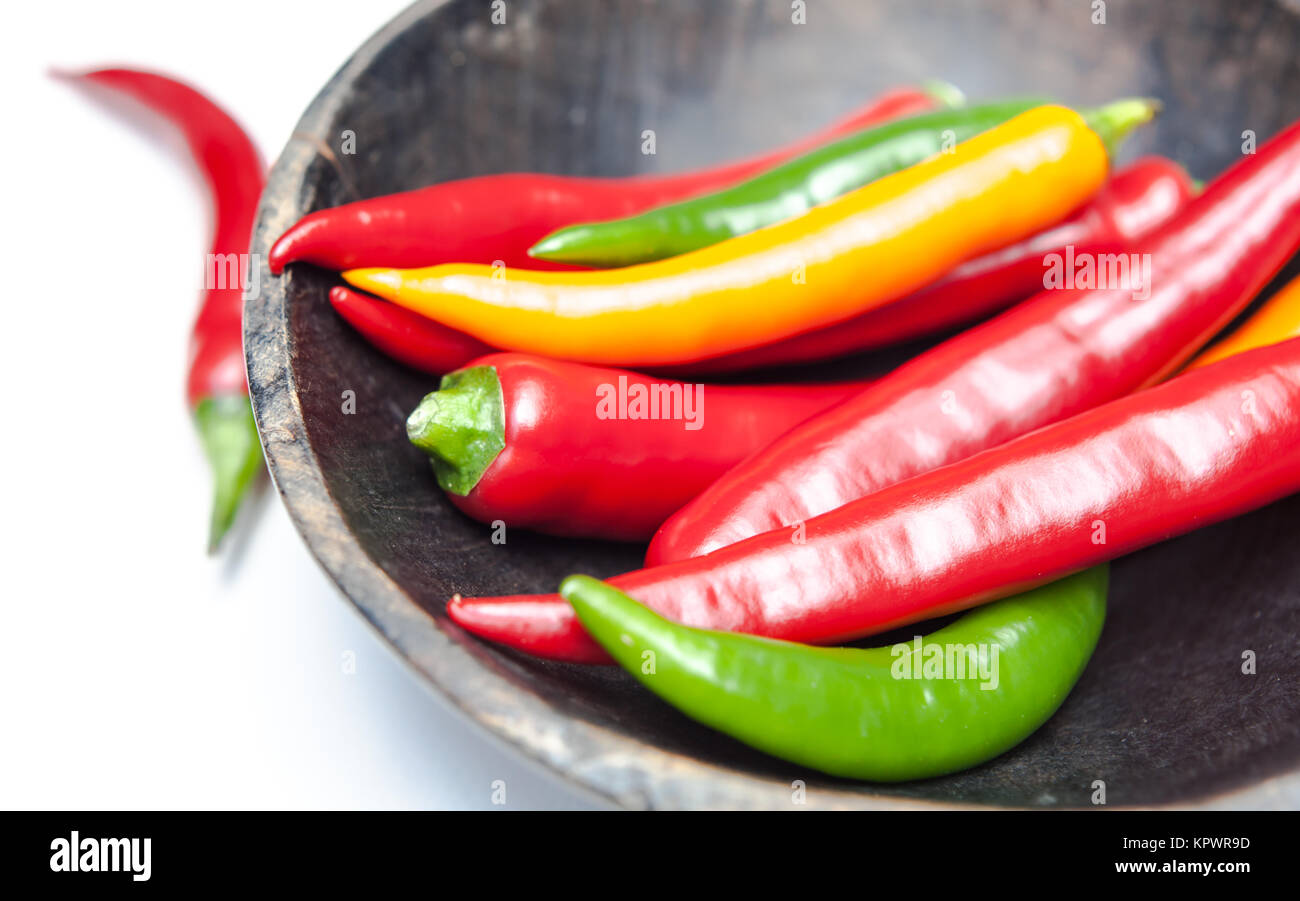 fresh pepperoni mixed color in wooden bowl on withe background Stock ...