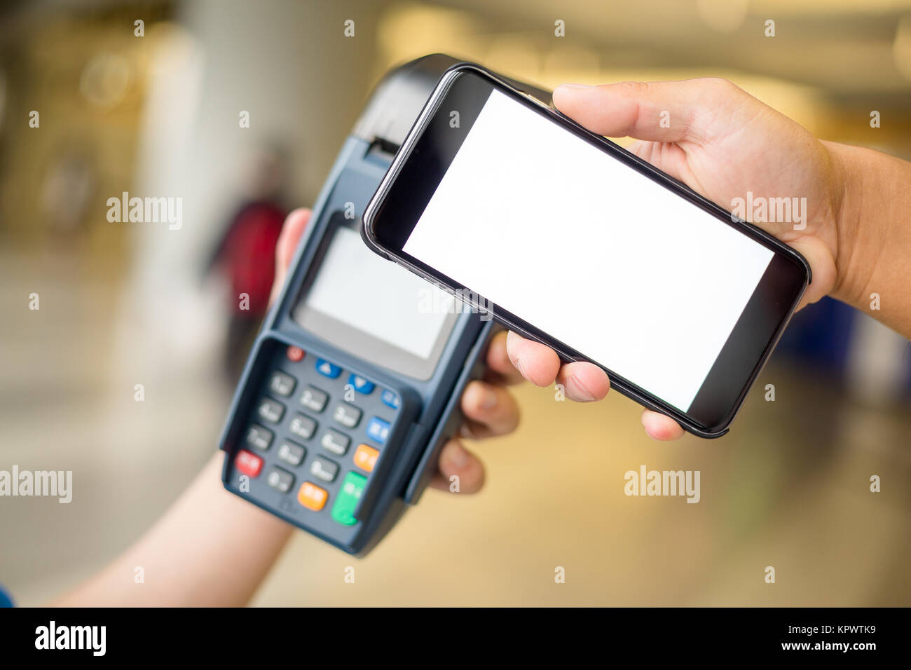Woman pay by smartphone with NFC Stock Photo - Alamy
