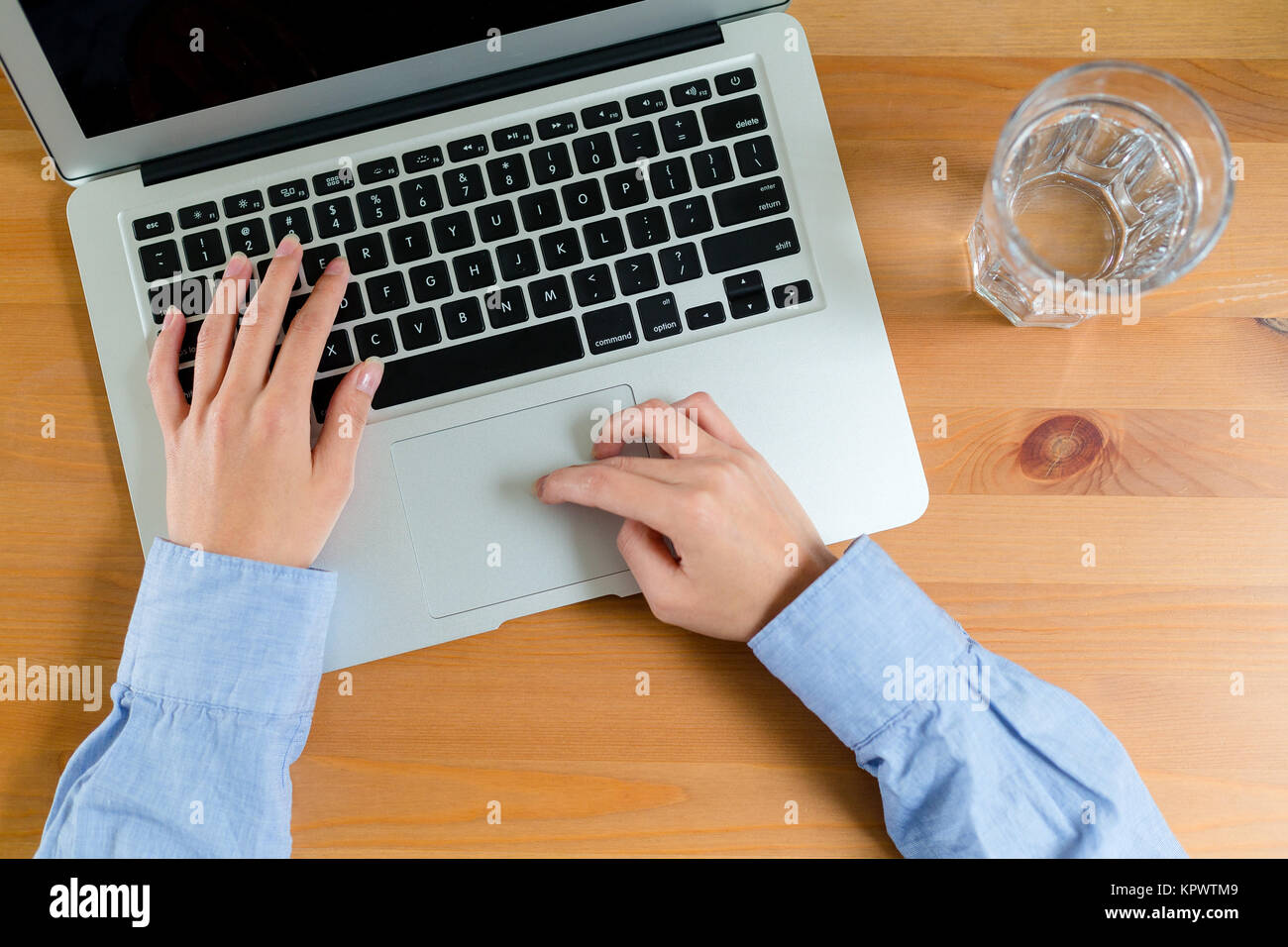 Top view of woman typing on laptop computer Stock Photo - Alamy